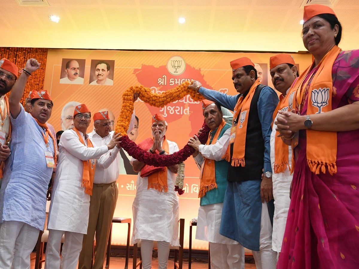 The cap worn by Narendra Modi during the Ahmedabad road show caught ...